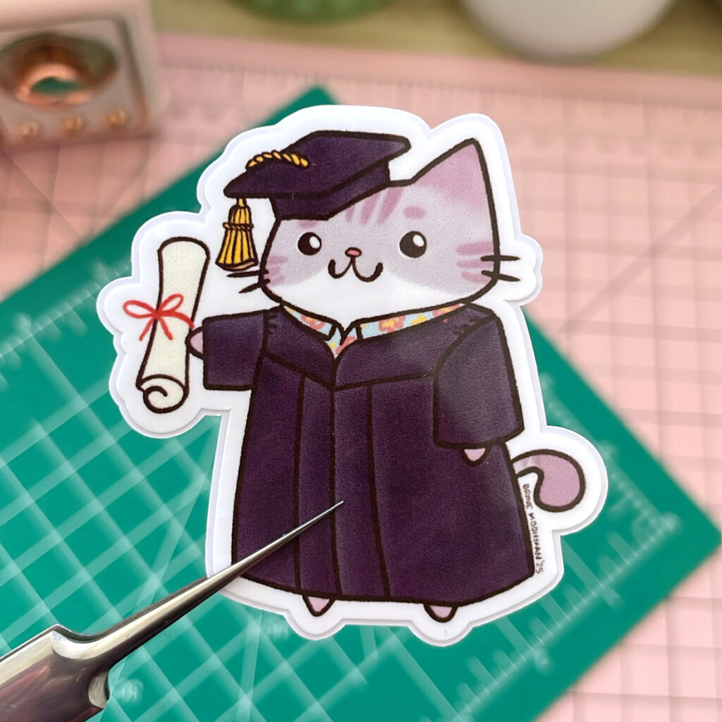 Graduation Cat Vinyl Sticker - Brave Moonman